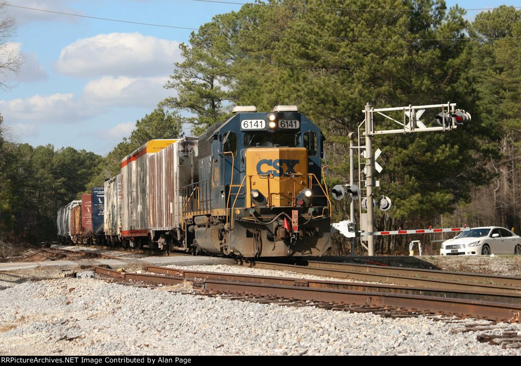 CSX GP40-2 6141 passes the crossing with a local